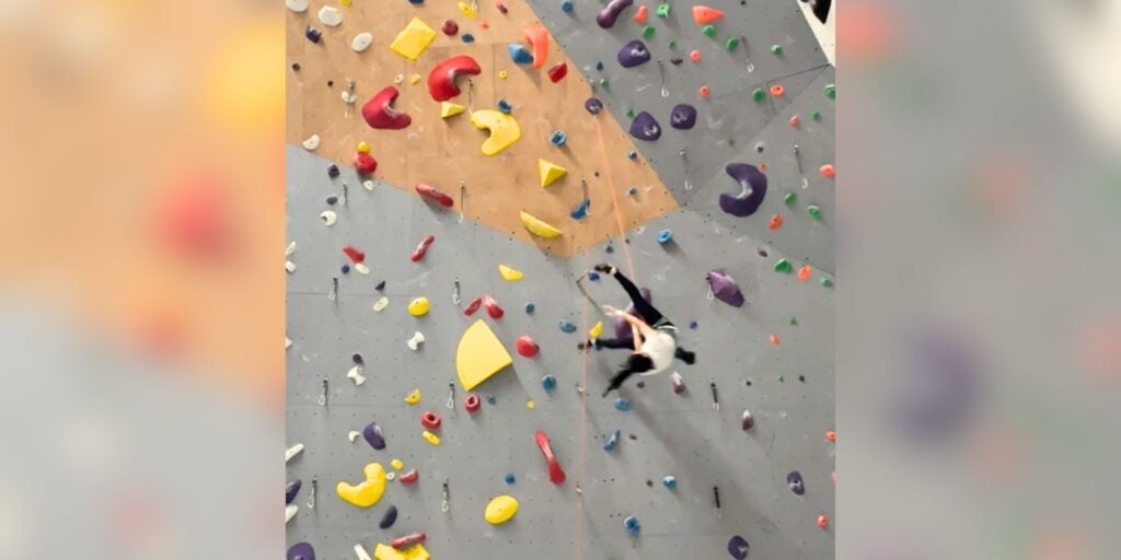 Indoor Climber Takes Upside Down Fall - Climbing